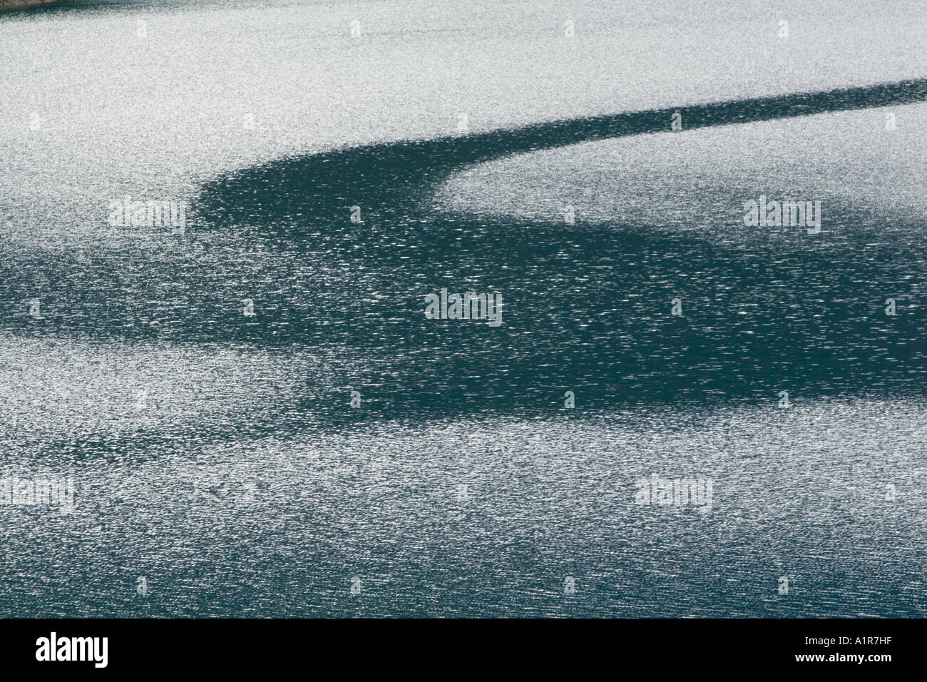 Reflections and wind ripples on surface of lake Stock Photo - Alamy
