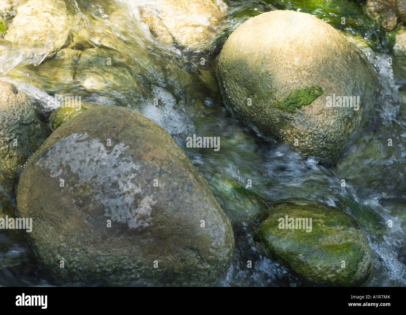 Water flowing through rocks Stock Photo - Alamy