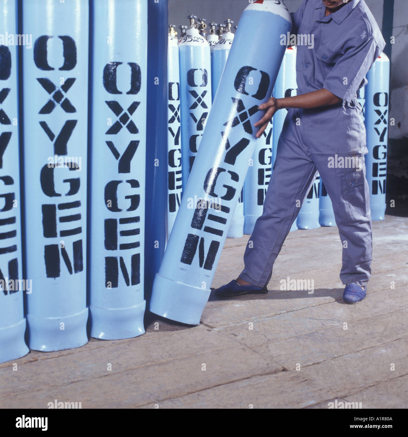 Oxygen Tanks With Worker Stock Photo - Alamy