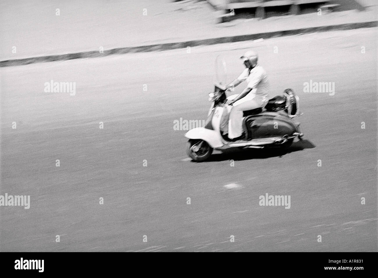 Indian man riding a scooter hi-res stock photography and images - Alamy