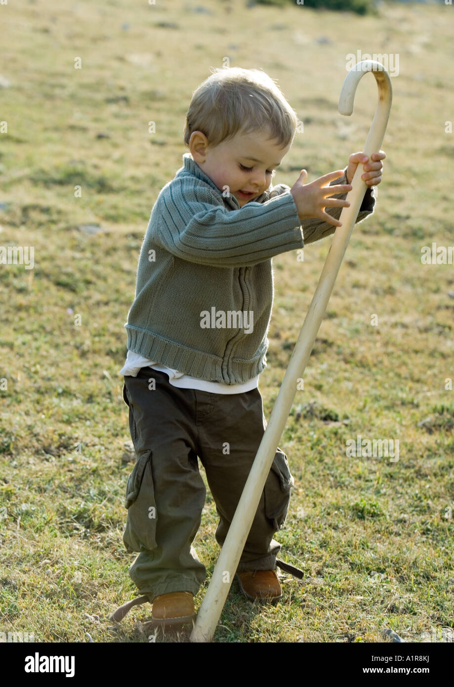 Boy holding cane Stock Photo - Alamy