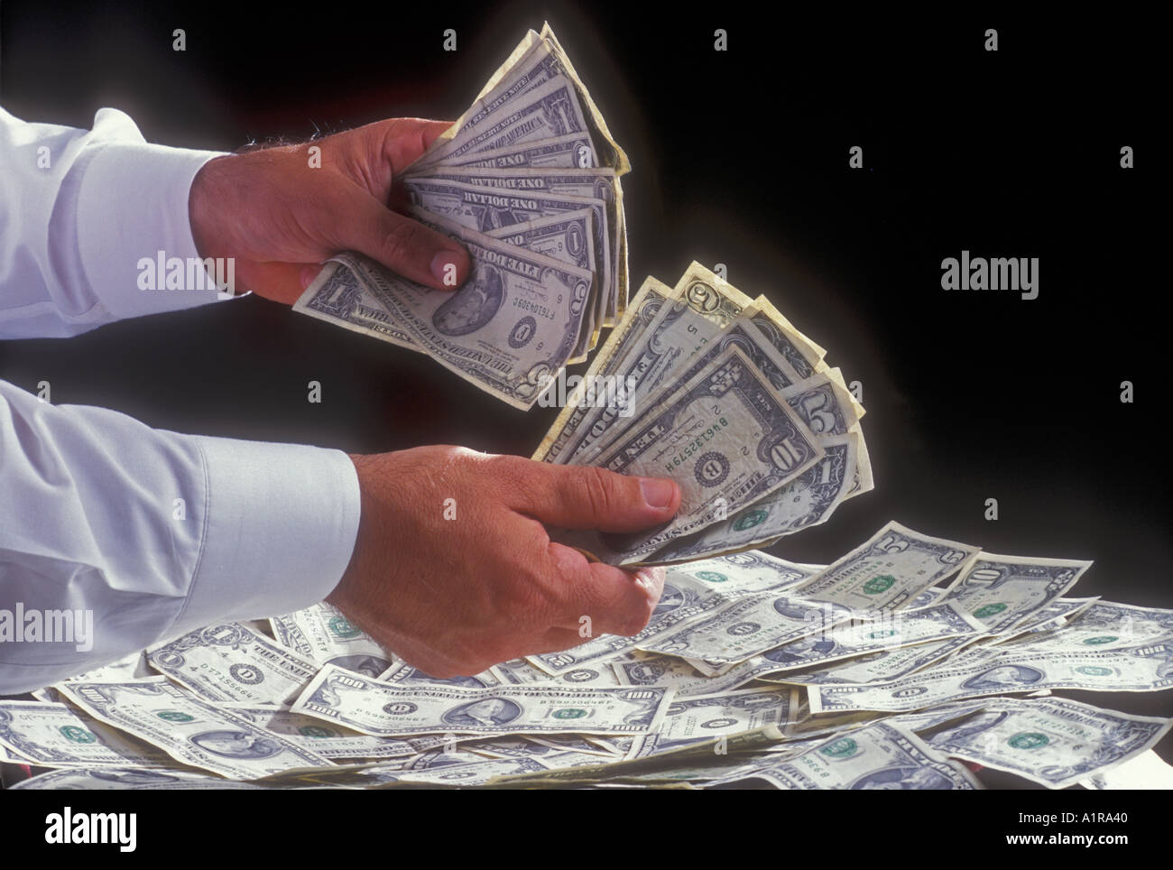 different dollar bills US money being counted by hand Stock Photo - Alamy