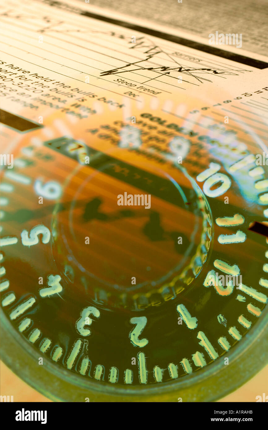 Combination Lock and Financial Newspaper Stock Photo - Alamy