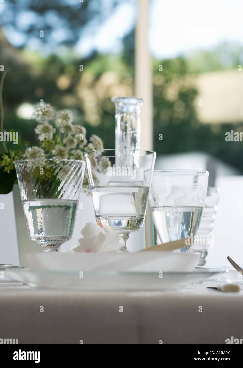 Glasses of water on set table Stock Photo - Alamy