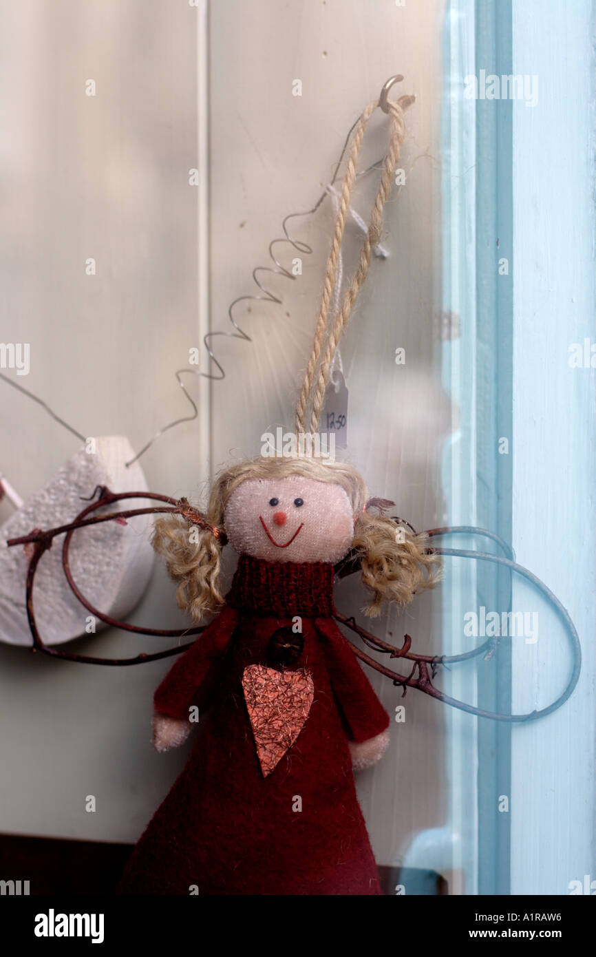 Christmas fairy on display in shop window Stock Photo - Alamy