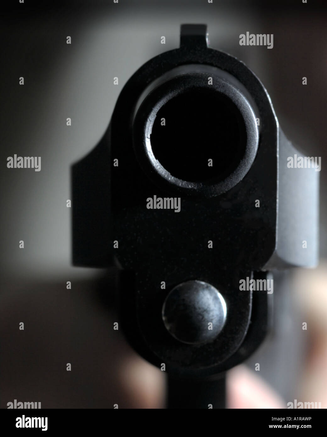 muzzle of a pointed pistol Stock Photo - Alamy