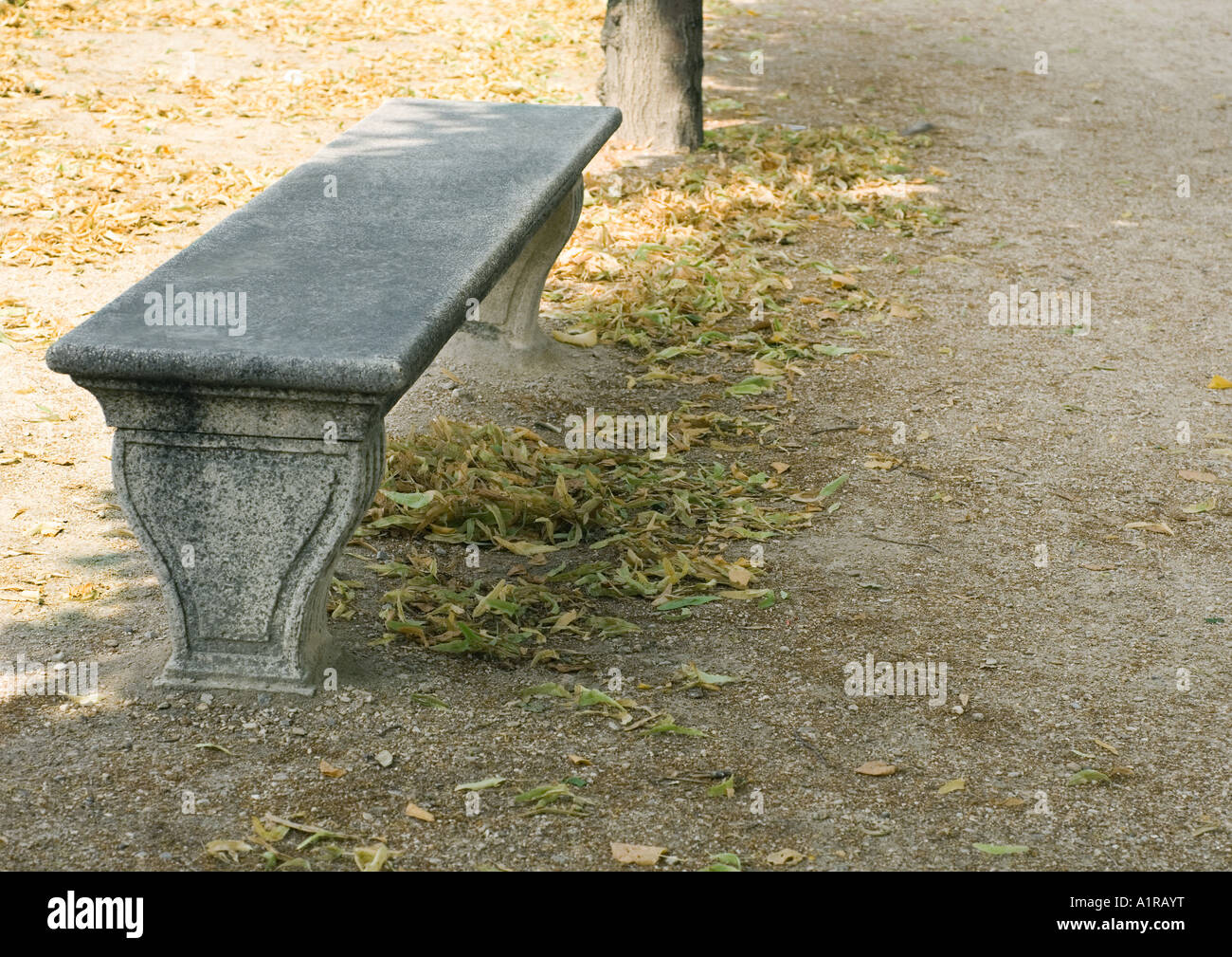 Concrete park bench Stock Photo - Alamy