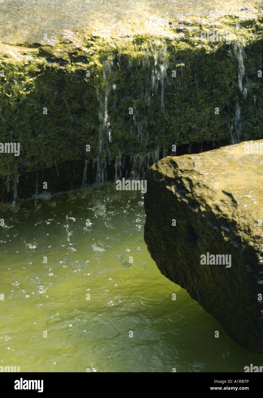 Water running over stones blocks, close-up Stock Photo - Alamy