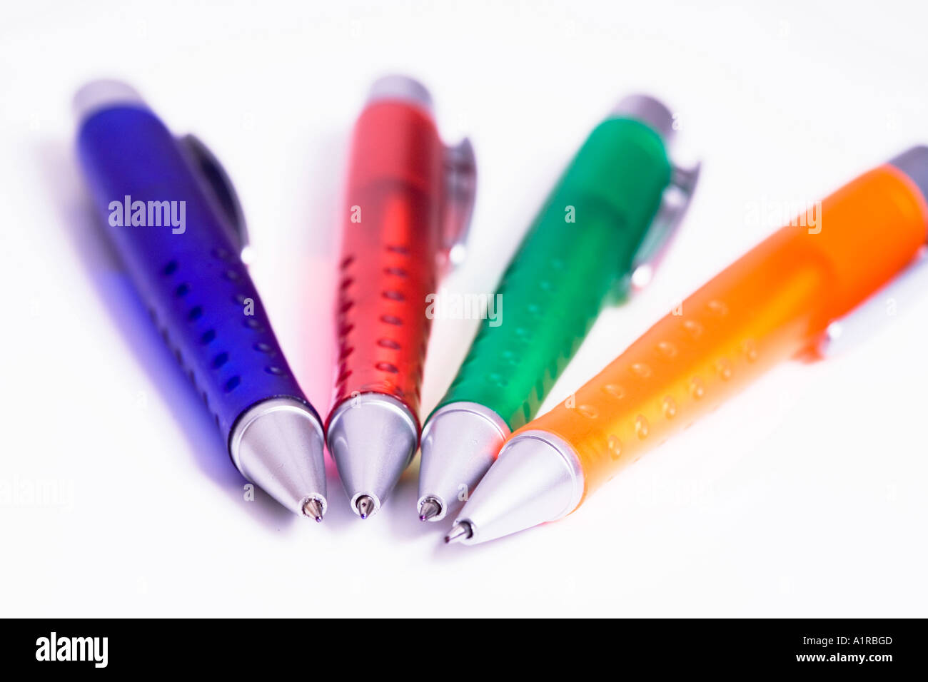 Ball pens in different color over a white background Stock Photo - Alamy