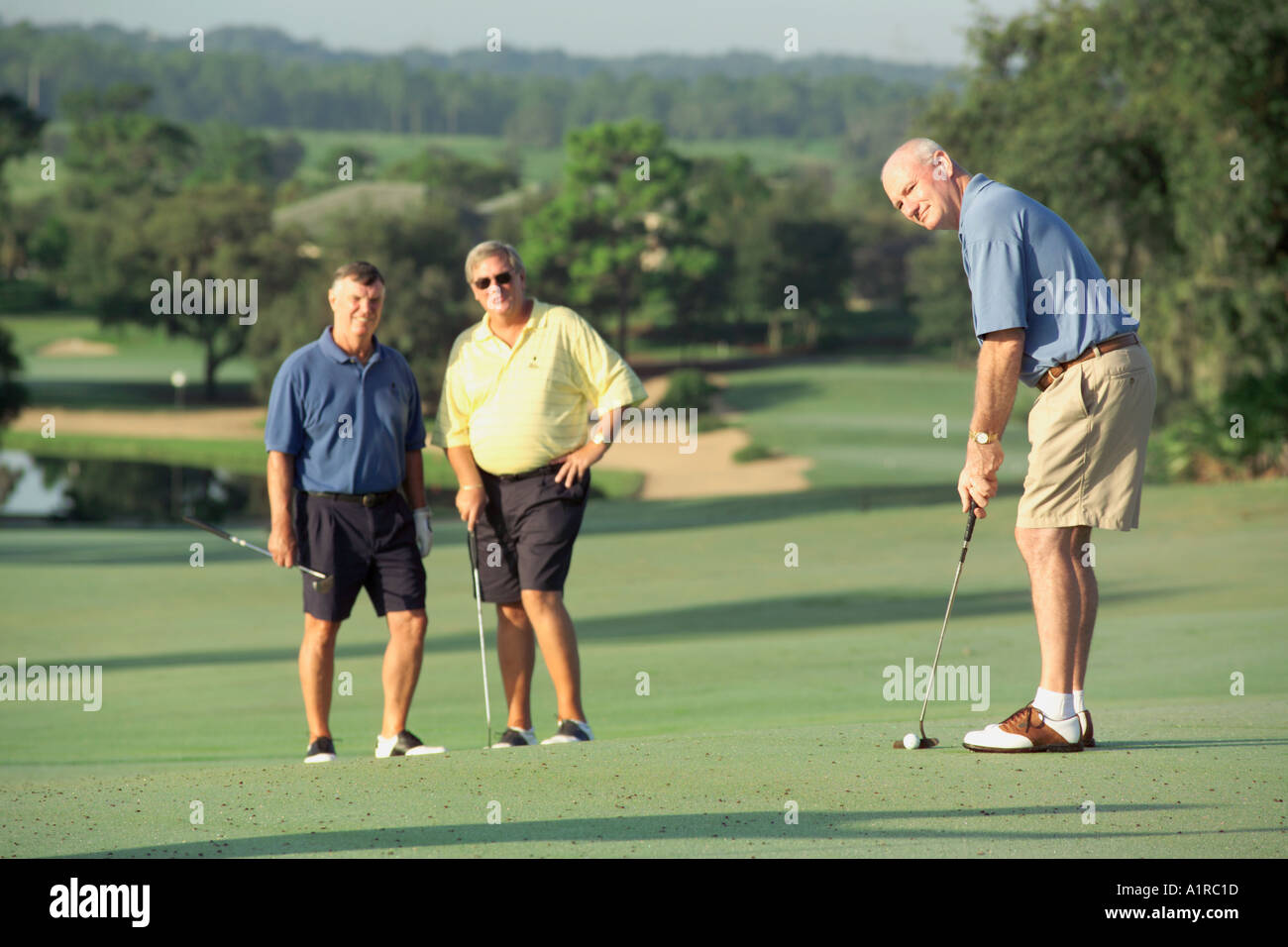Senior men on golf course Stock Photo - Alamy