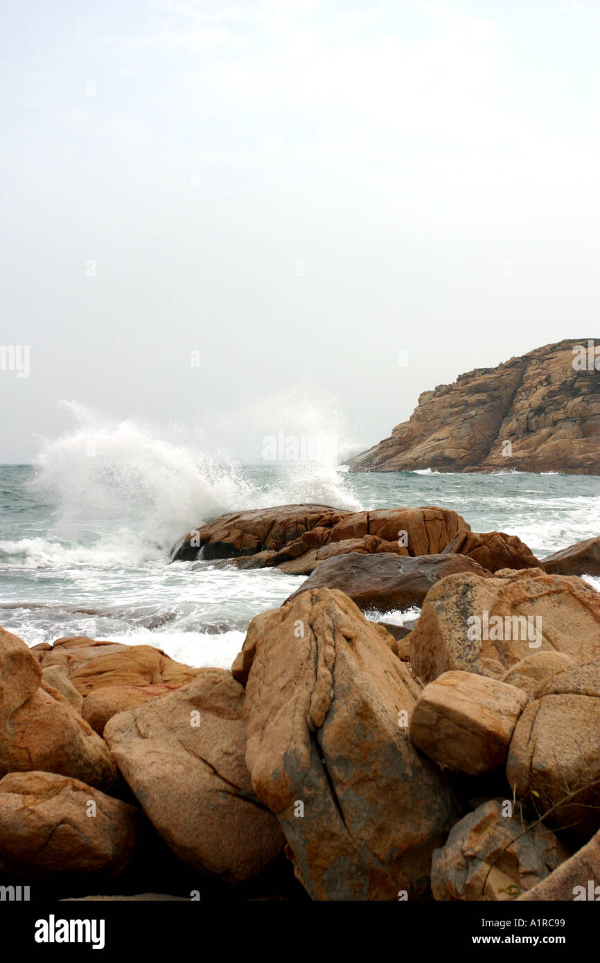 Giant wave Rocky beach Impact sea mountain Spray Stock Photo - Alamy