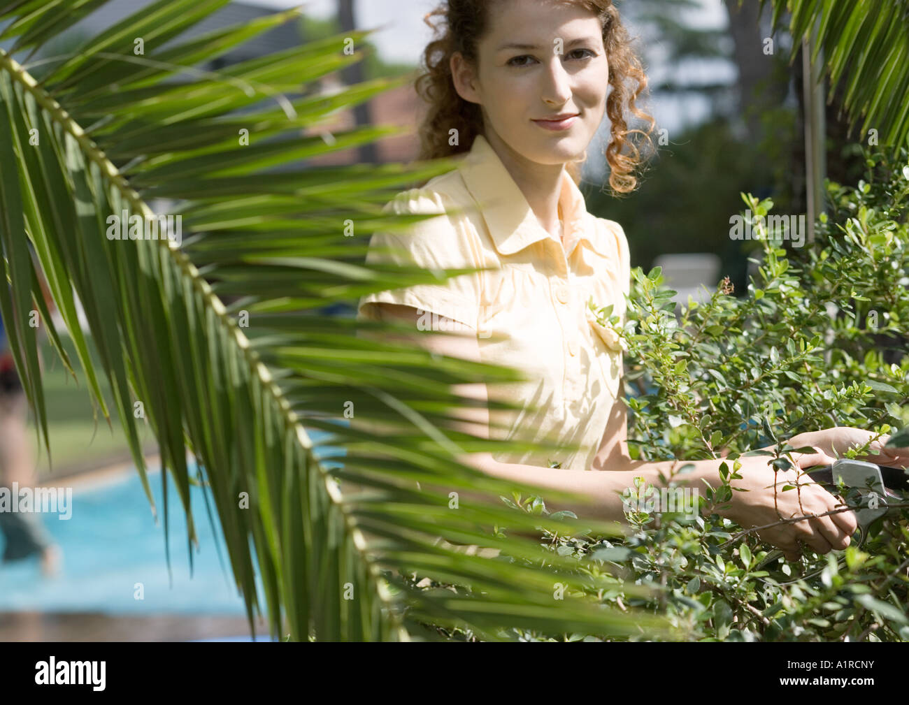 Woman doing yardwork Stock Photo - Alamy