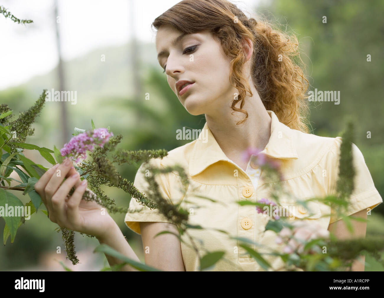 Woman doing yardwork Stock Photo - Alamy