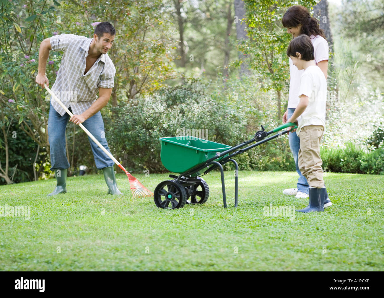 Family doing yardwork Stock Photo - Alamy