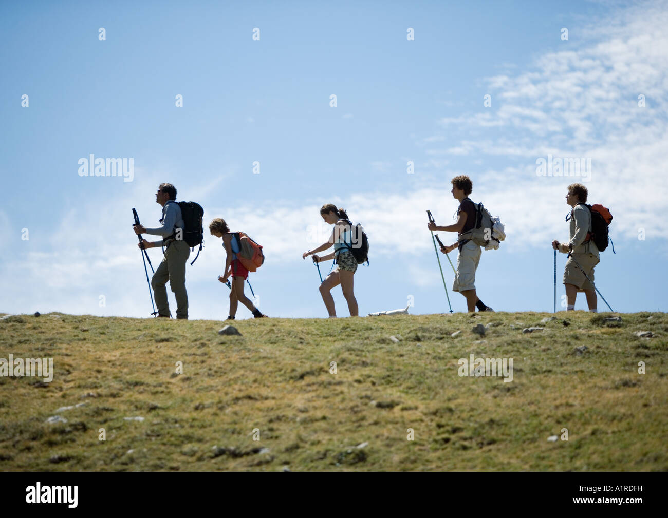 Hikers walking in line Stock Photo - Alamy