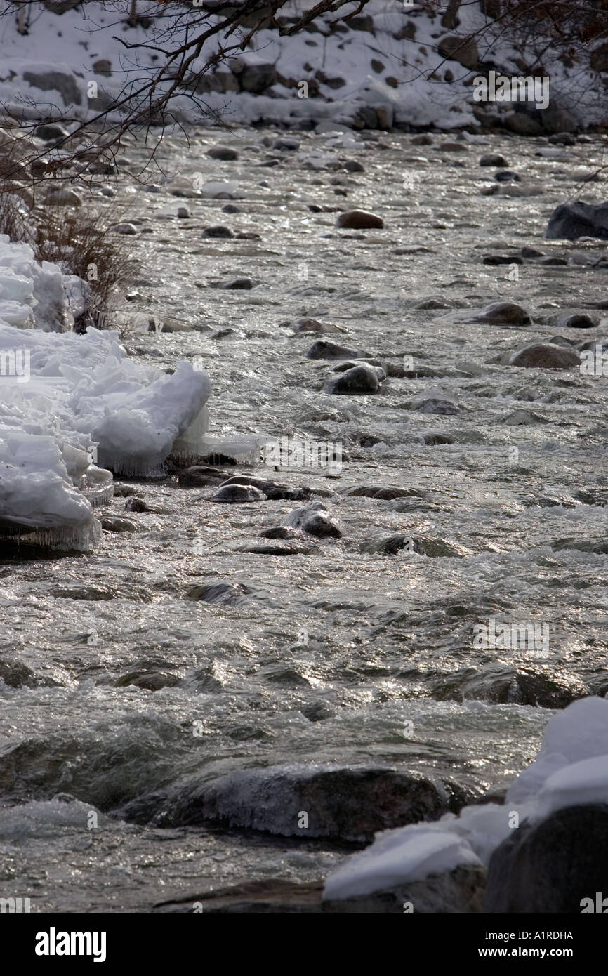 Water flowing down an icy stream Stock Photo - Alamy