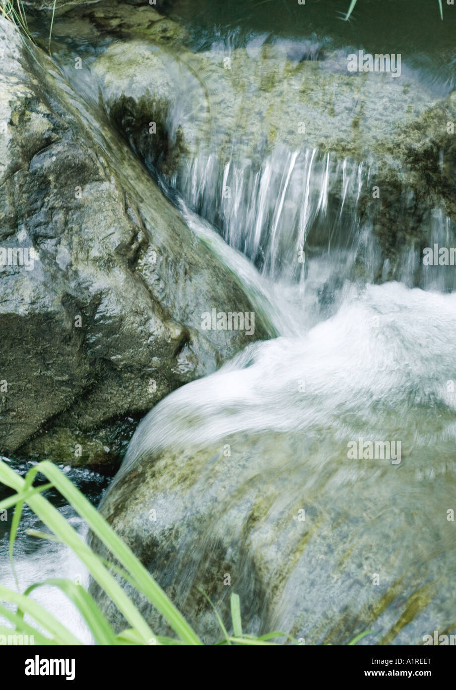 Water running over stones Stock Photo - Alamy