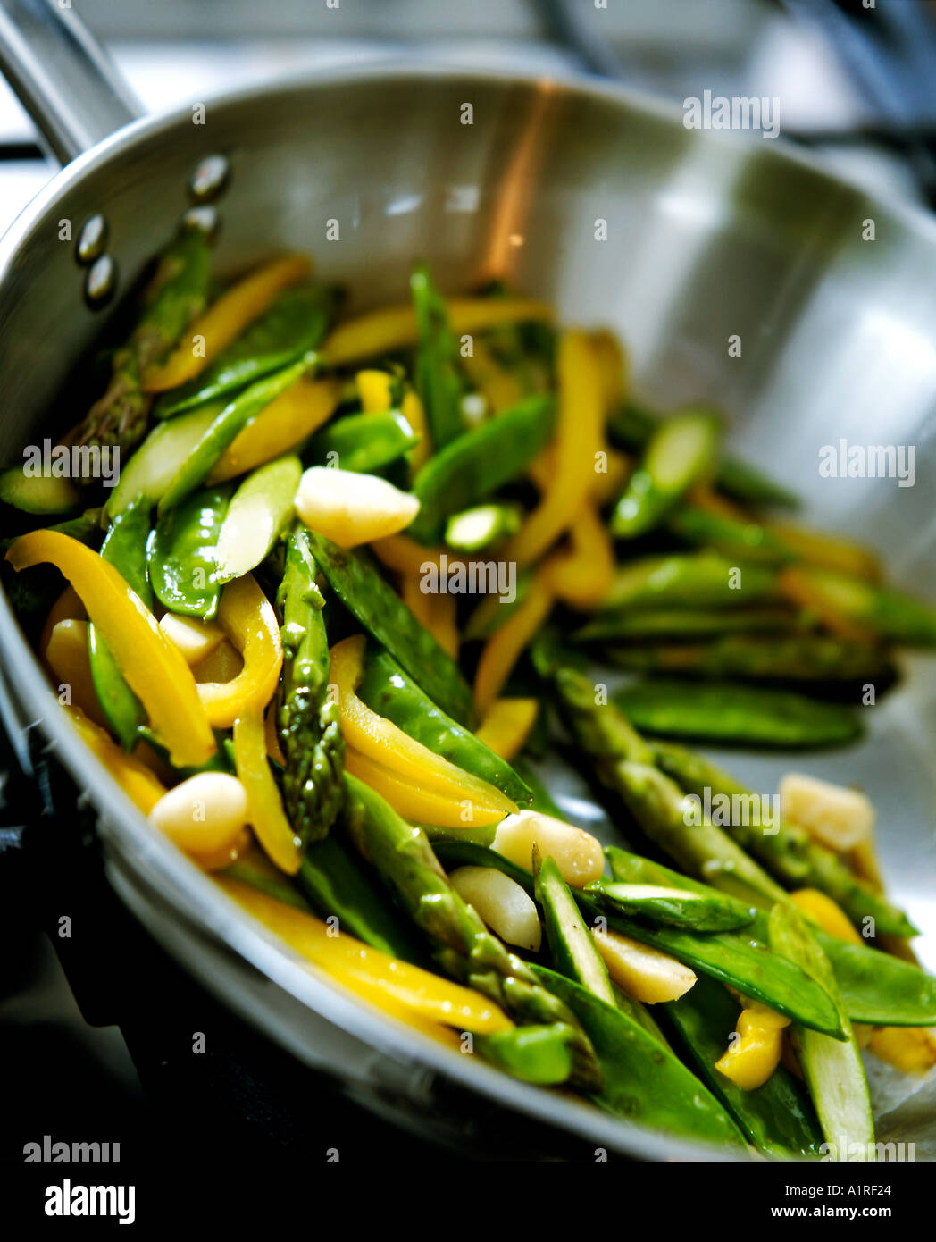 Pan of fresh vegetables being stir fried Stock Photo - Alamy