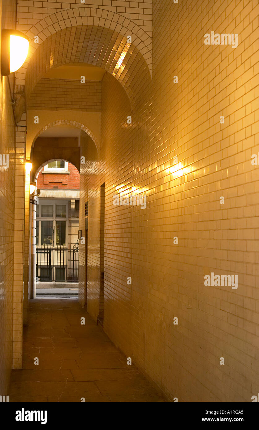 dimly lit passage way in city of london Stock Photo - Alamy
