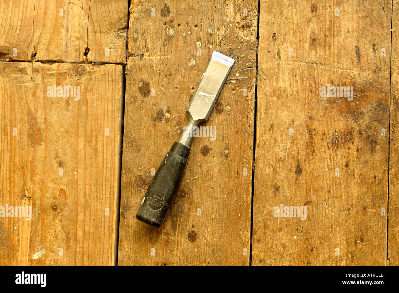 chisel lying on floorboard Stock Photo - Alamy