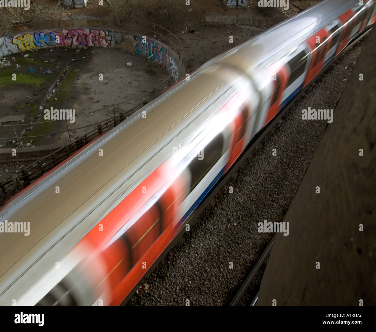 blurred train shot from above passing through wasteland Stock Photo - Alamy