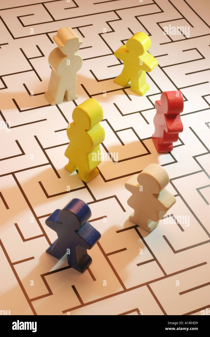 Wooden Children Figures on Maze Stock Photo - Alamy