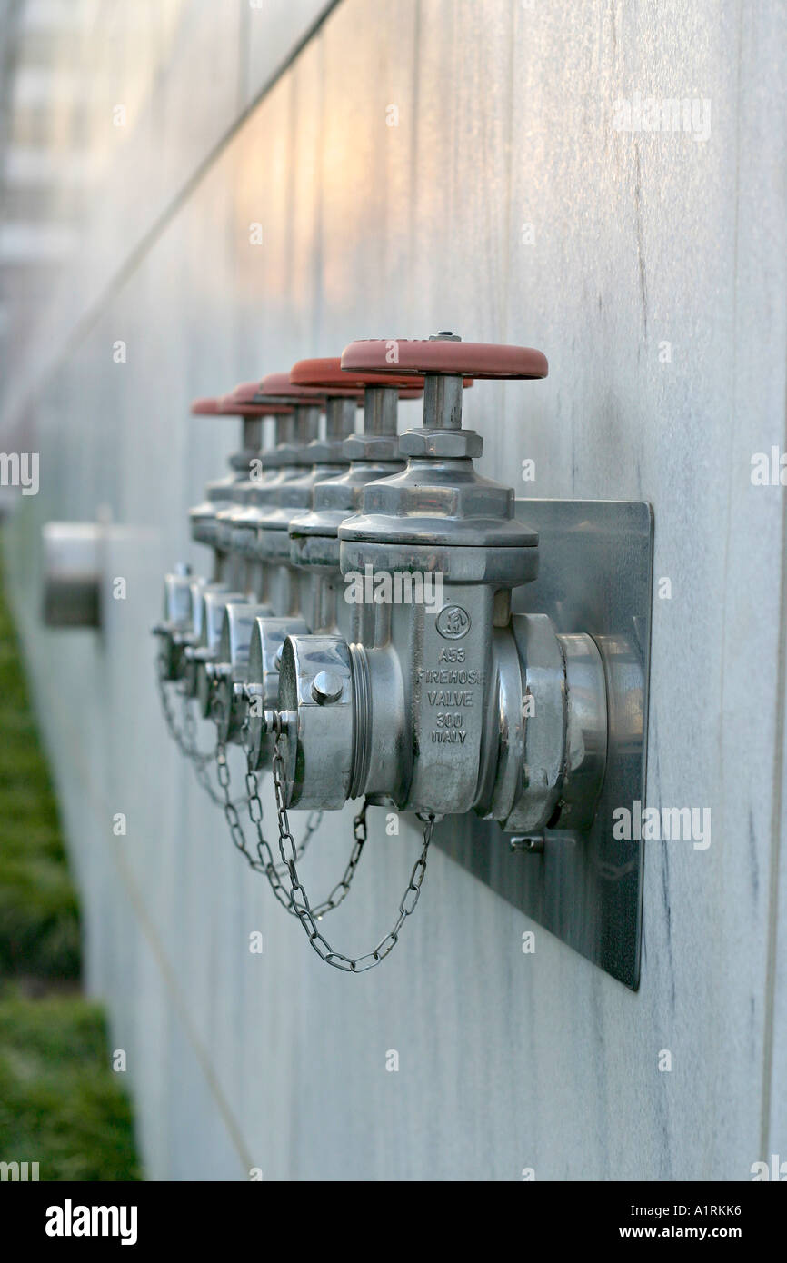 Standpipe Connections: A row of chromed fire hose connectors topped ... Standpipe Connections: A row of chromed fire hose connectors topped ...