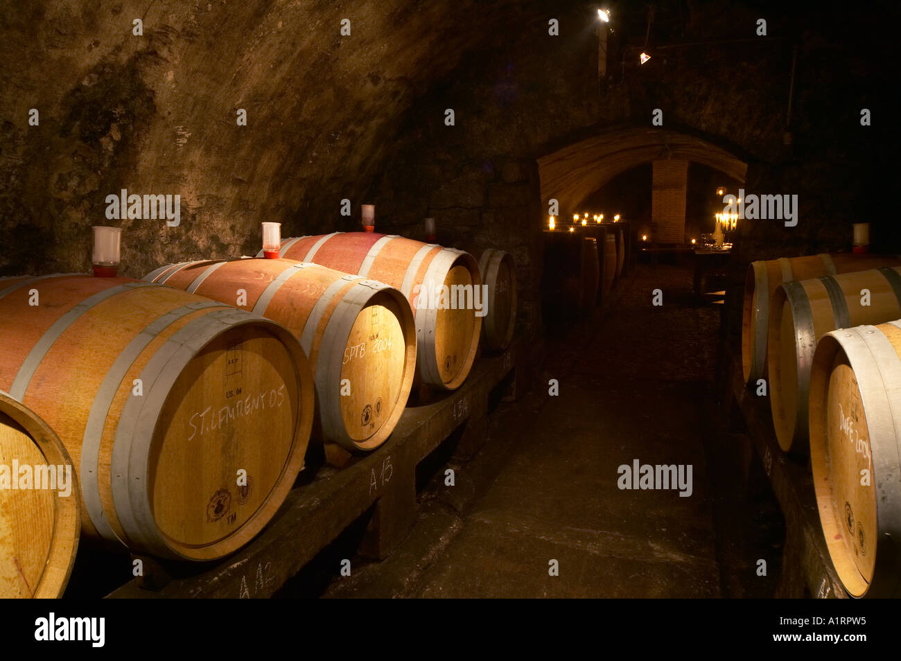 barrique wooden vats or casks in German wine cellar for vinification of ...