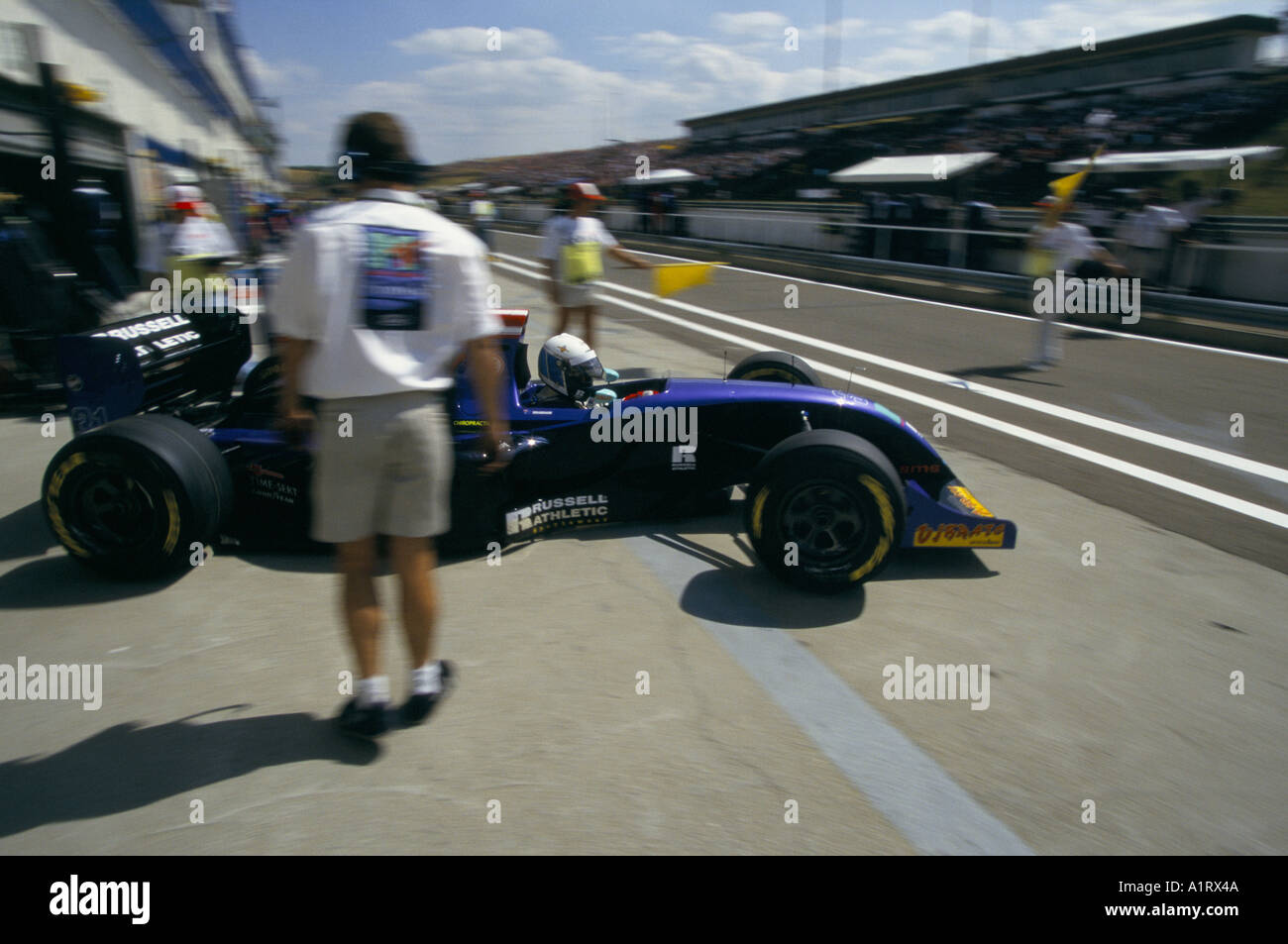 A BLUE RACE CAR PART OF THE SIMTEK F1 TEAM AT THE HUNGARIAN GRAND PRIX ...