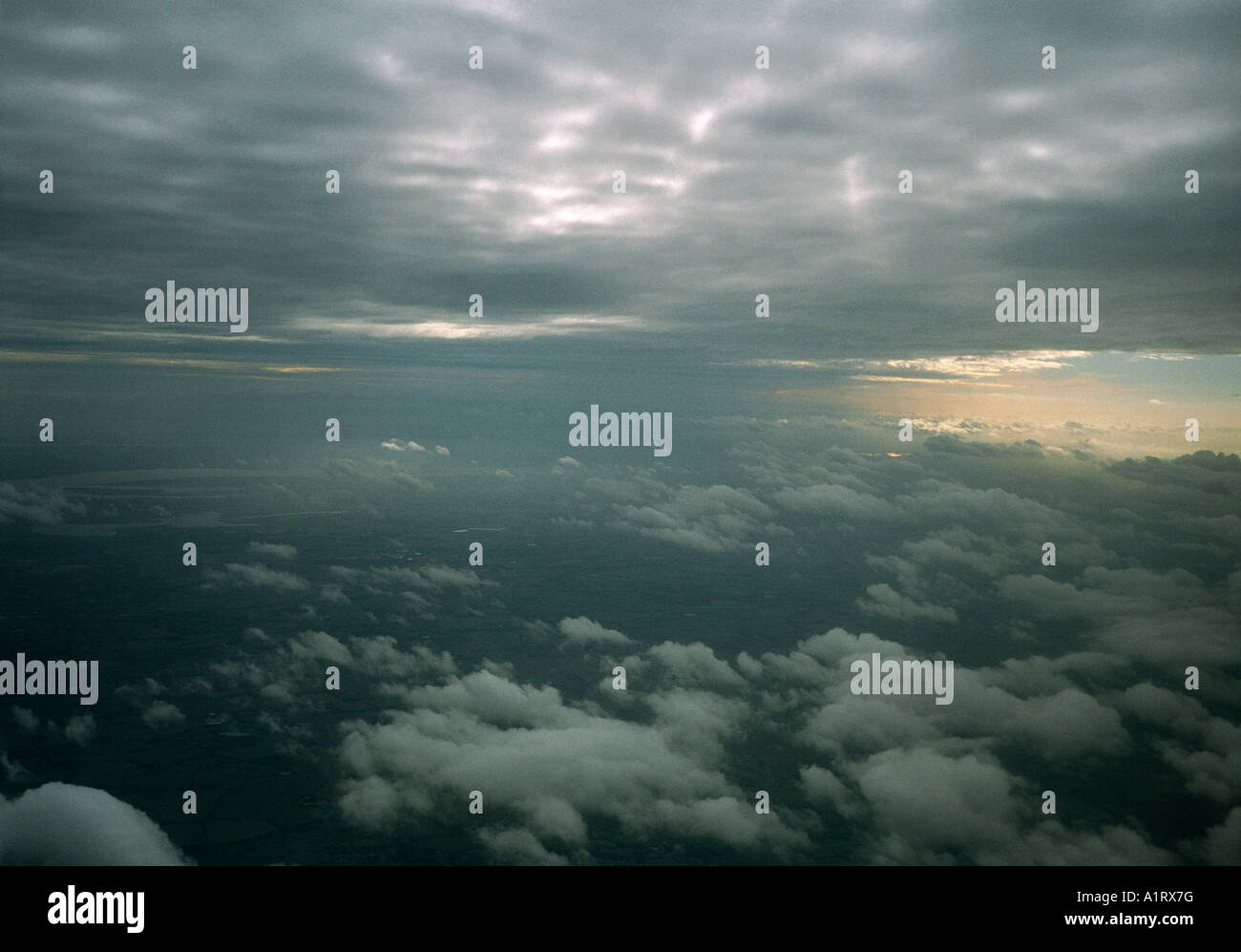 Plane flying through clouds in hi-res stock photography and images - Alamy