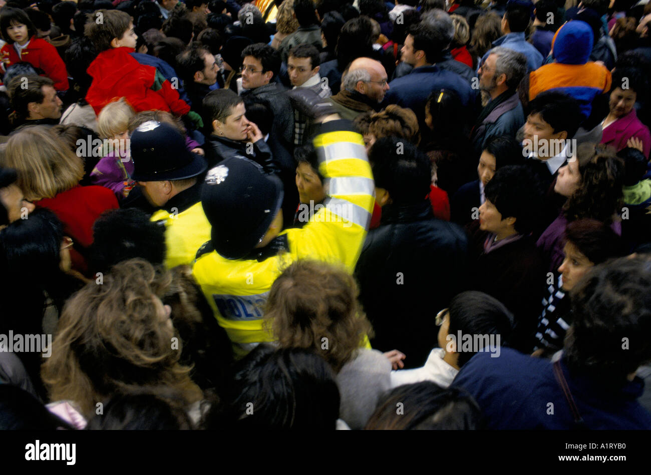 TWO POLICEMEN IN THE CROWD DURING THE CHINESES NEW YEAR CELEBRATION ...