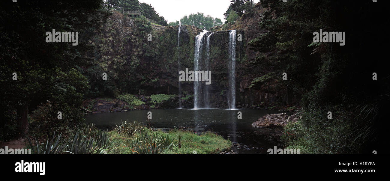 Panoramic format vista of Whangarei waterfalls cascading into a pool at ...