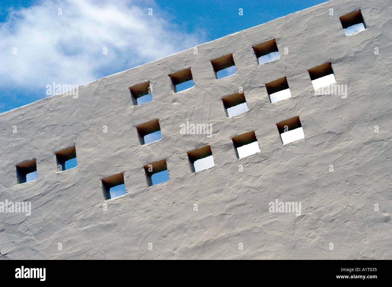 Top of a wall with square holes Stock Photo - Alamy