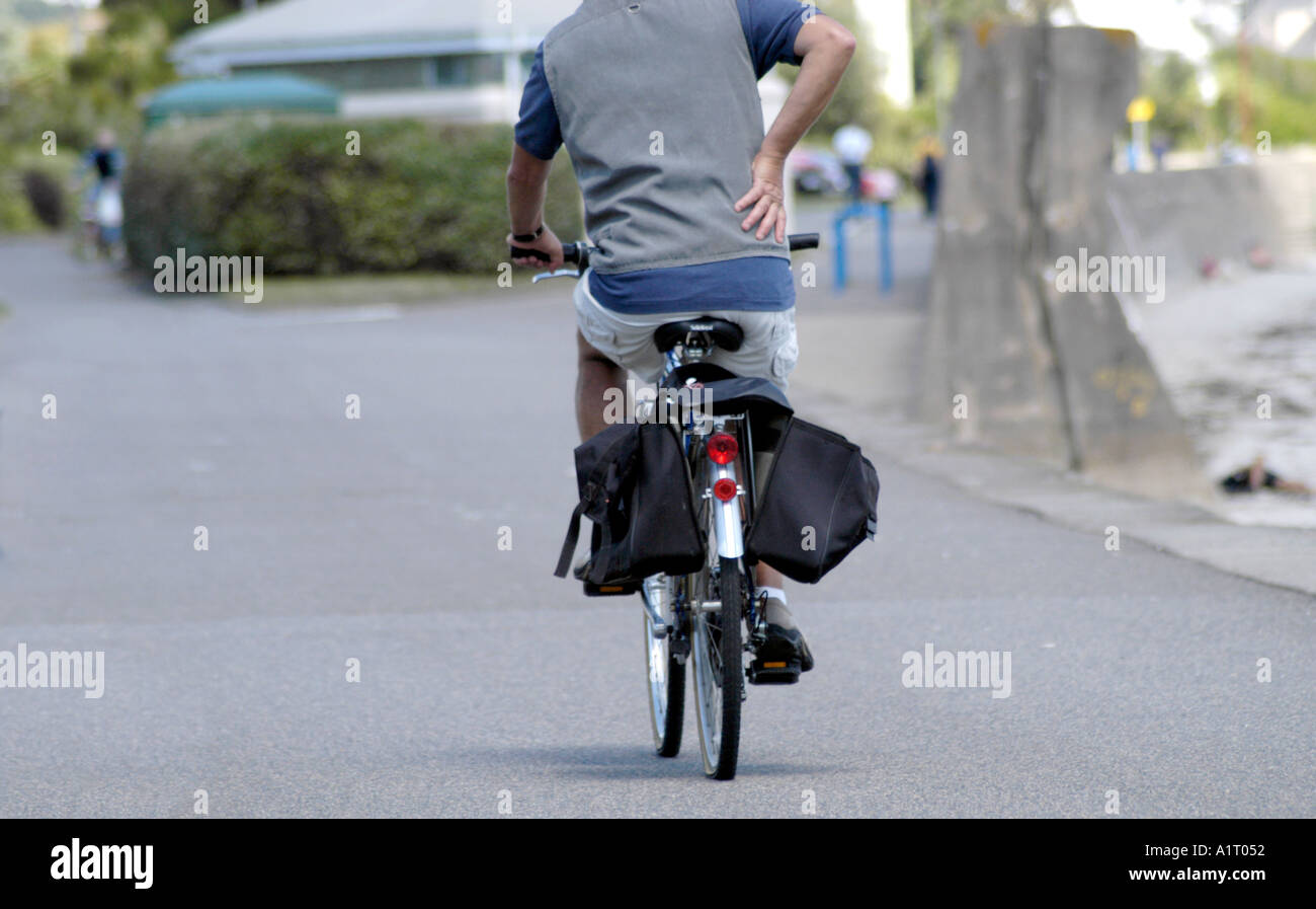 Cycling with a sore back Stock Photo - Alamy