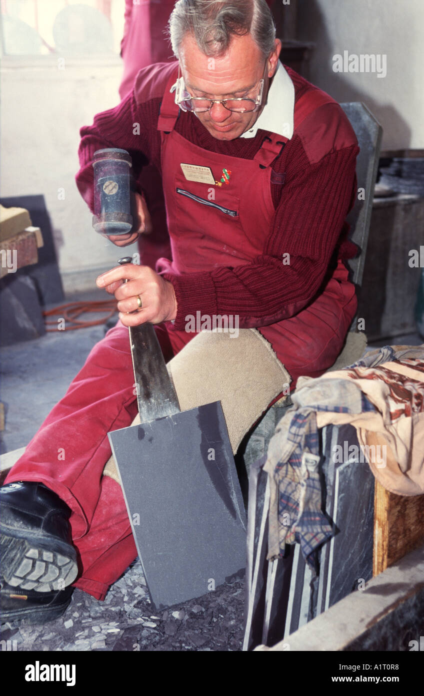 craftsman splitting slate Stock Photo - Alamy