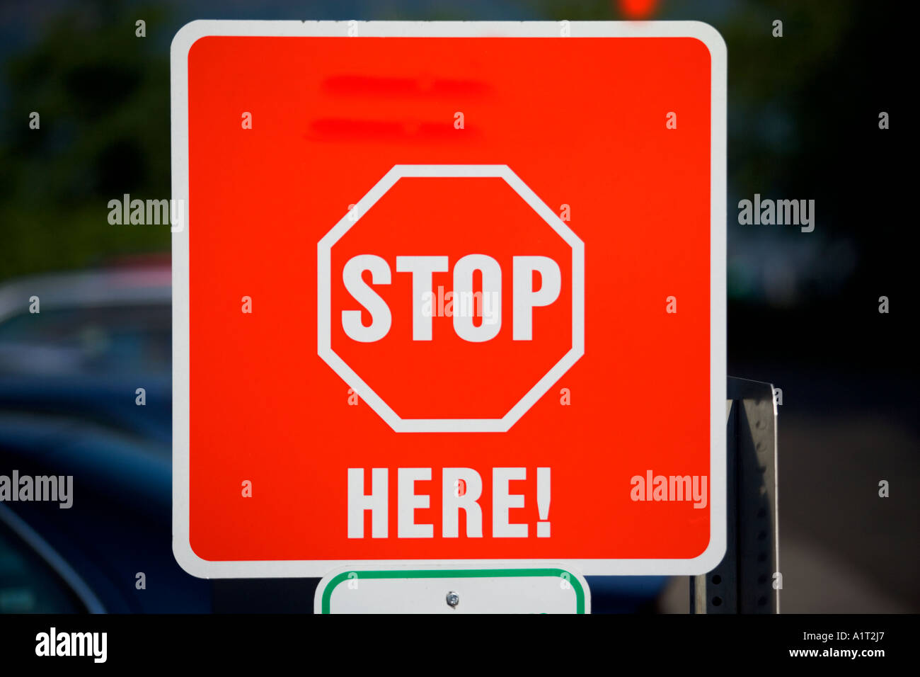 STOP HERE SIGN Stock Photo - Alamy