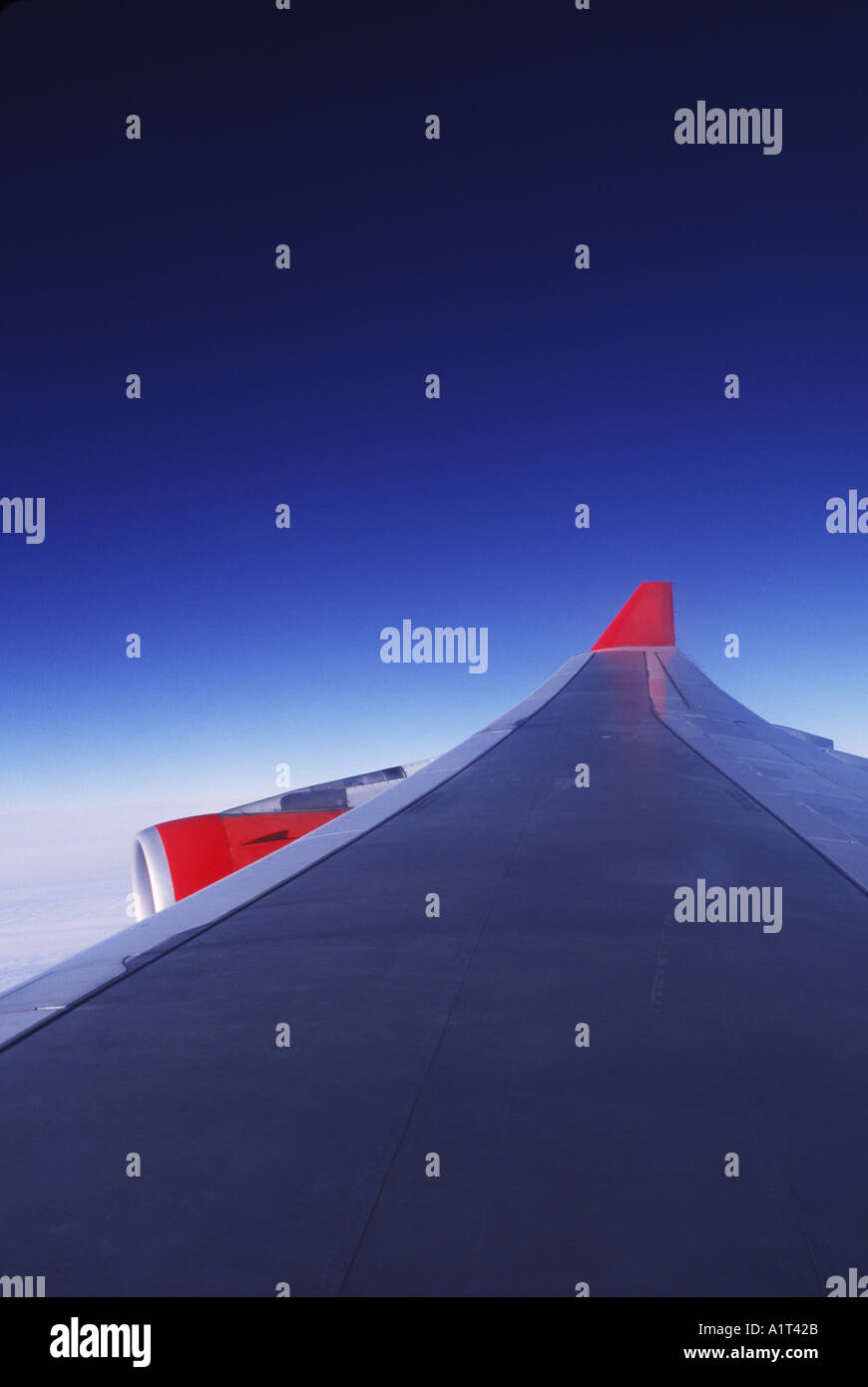 Red engine and wingtip Stock Photo - Alamy