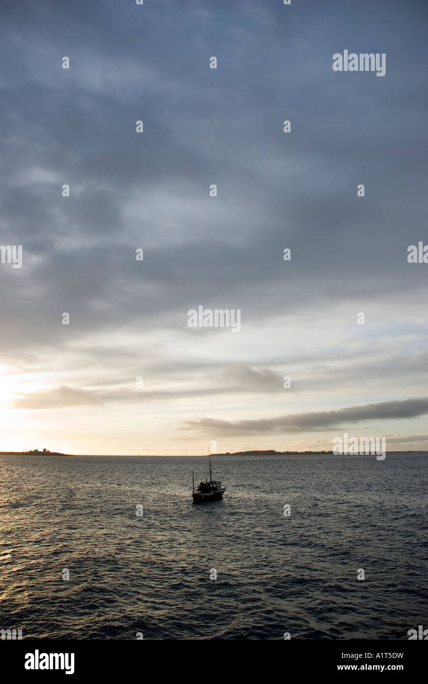 Boat in sunset Stock Photo - Alamy
