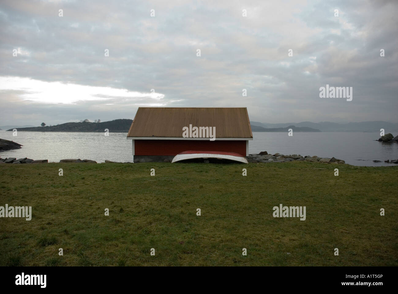 Red boat house by the sea Stock Photo - Alamy