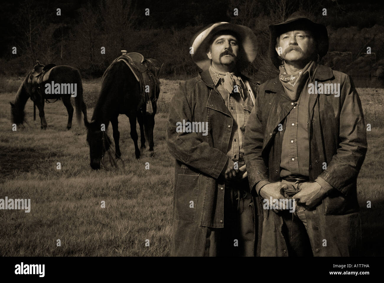 two cowboys pose for a photograph Stock Photo - Alamy