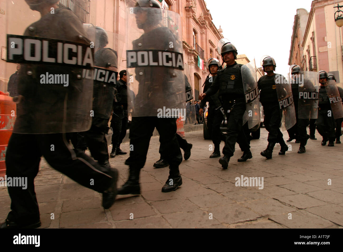 police in mexico prepare a barricade during a visit by a politician ...