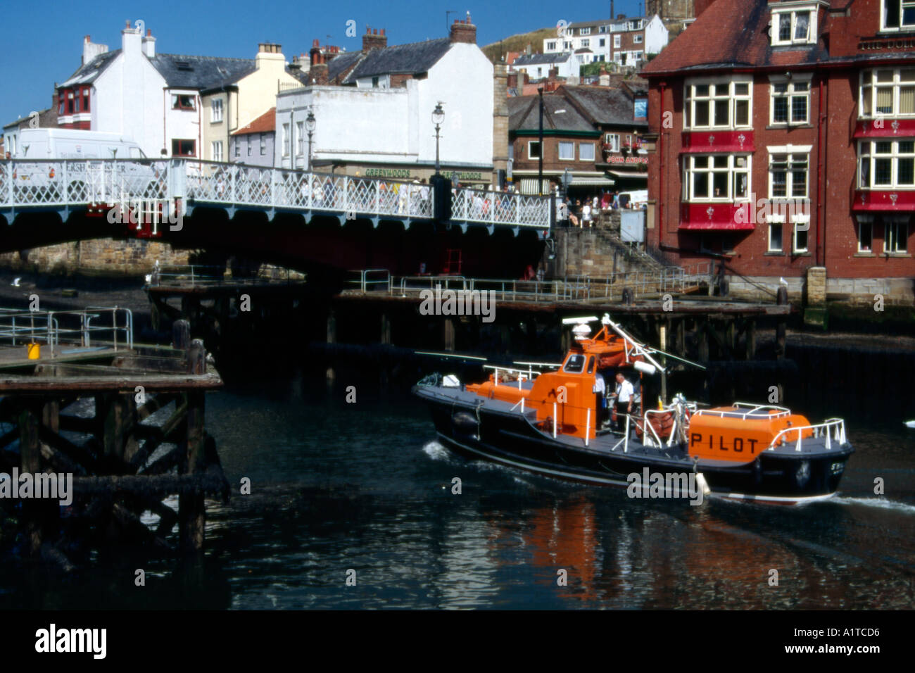 Whitby pilot boat leaving the harbour Stock Photo - Alamy