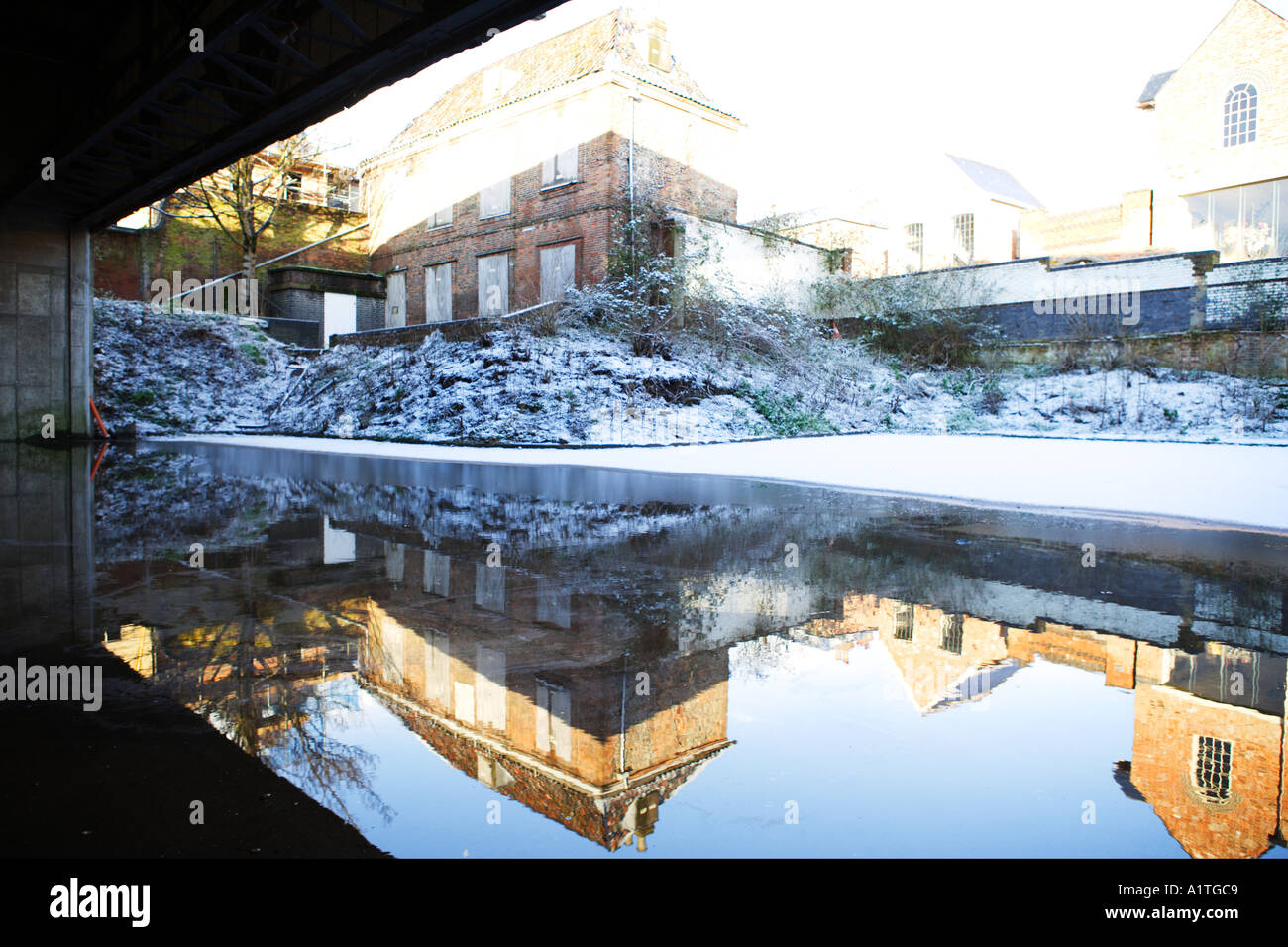 Old Warehouse and Derelict House with Large Puddle Snow Stock Photo - Alamy