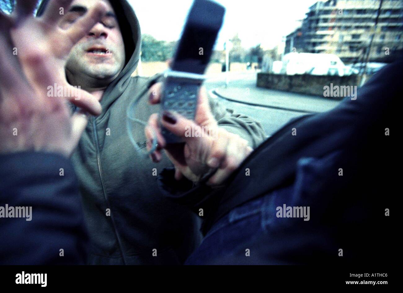 Street crime mobile phone theft Posed by model Stock Photo - Alamy