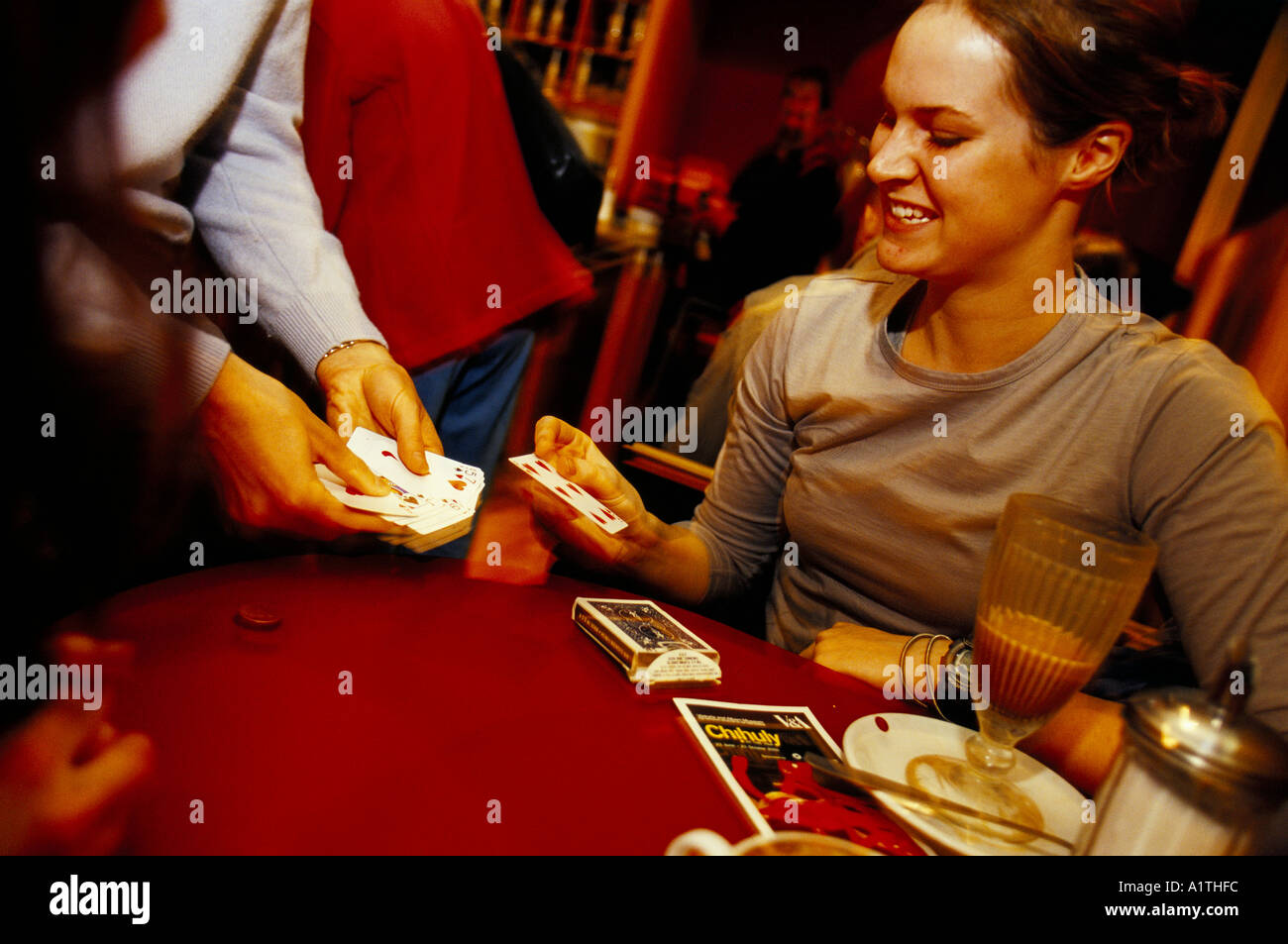Girl shuffling cards hi-res stock photography and images - Alamy