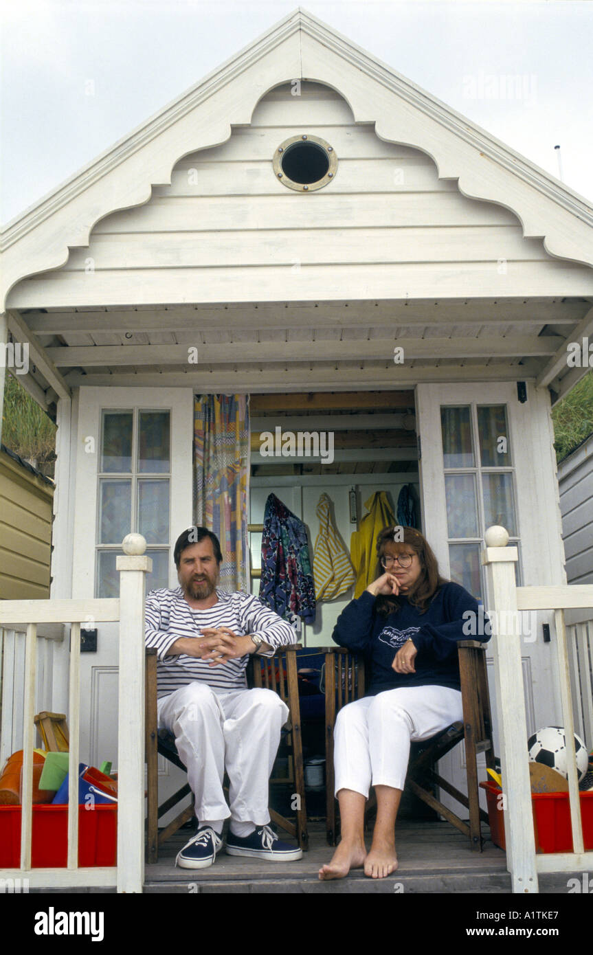 FATHER MOTHER OF THE BENNETT FAMILY SITTING OUTSIDE THEIR BEACH HUT IN ...