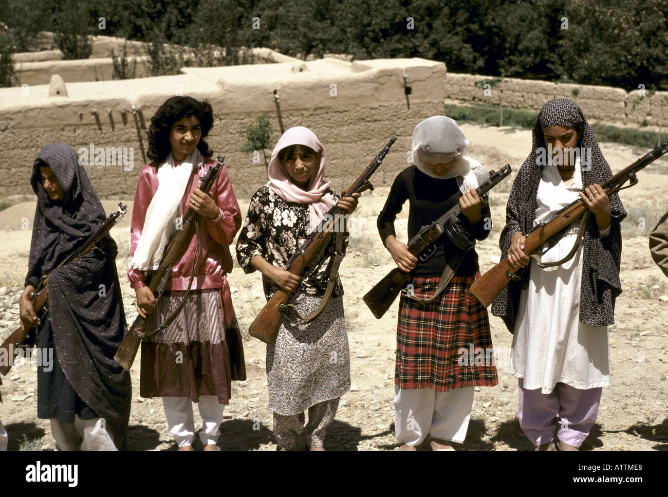 WOMEN WITH GUNS IN VILLAGE MILITIA Stock Photo - Alamy