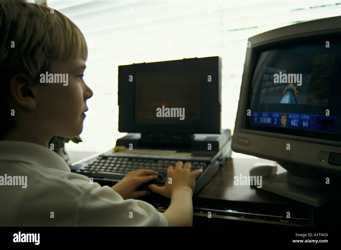 CHILD PLAYING ON COMPUTER HAMPSHIRE 1993 Stock Photo - Alamy