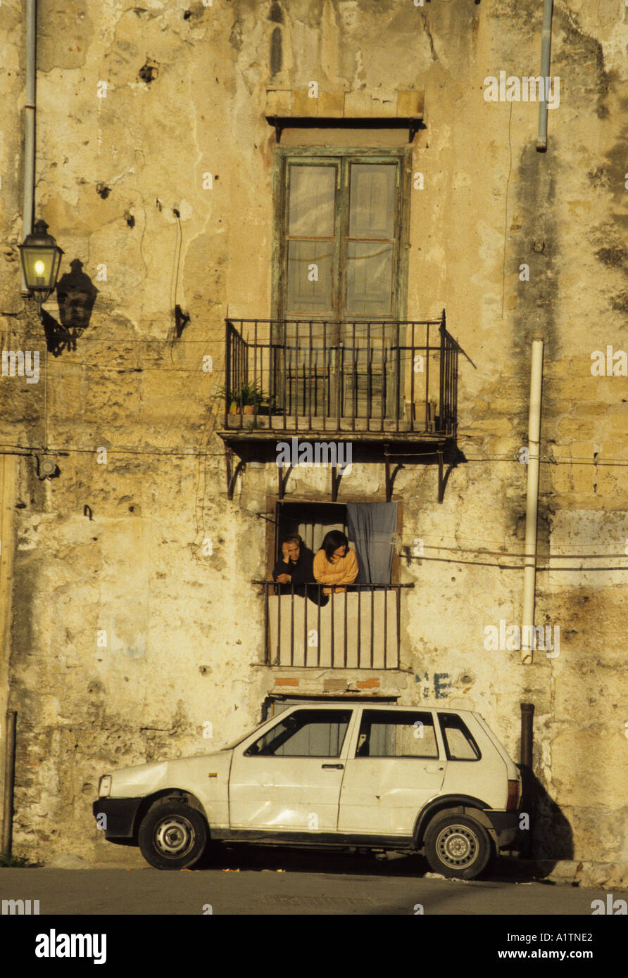 Slum dwelling inhabitants and wrecked car in Palermo Sicily Italy Stock ...