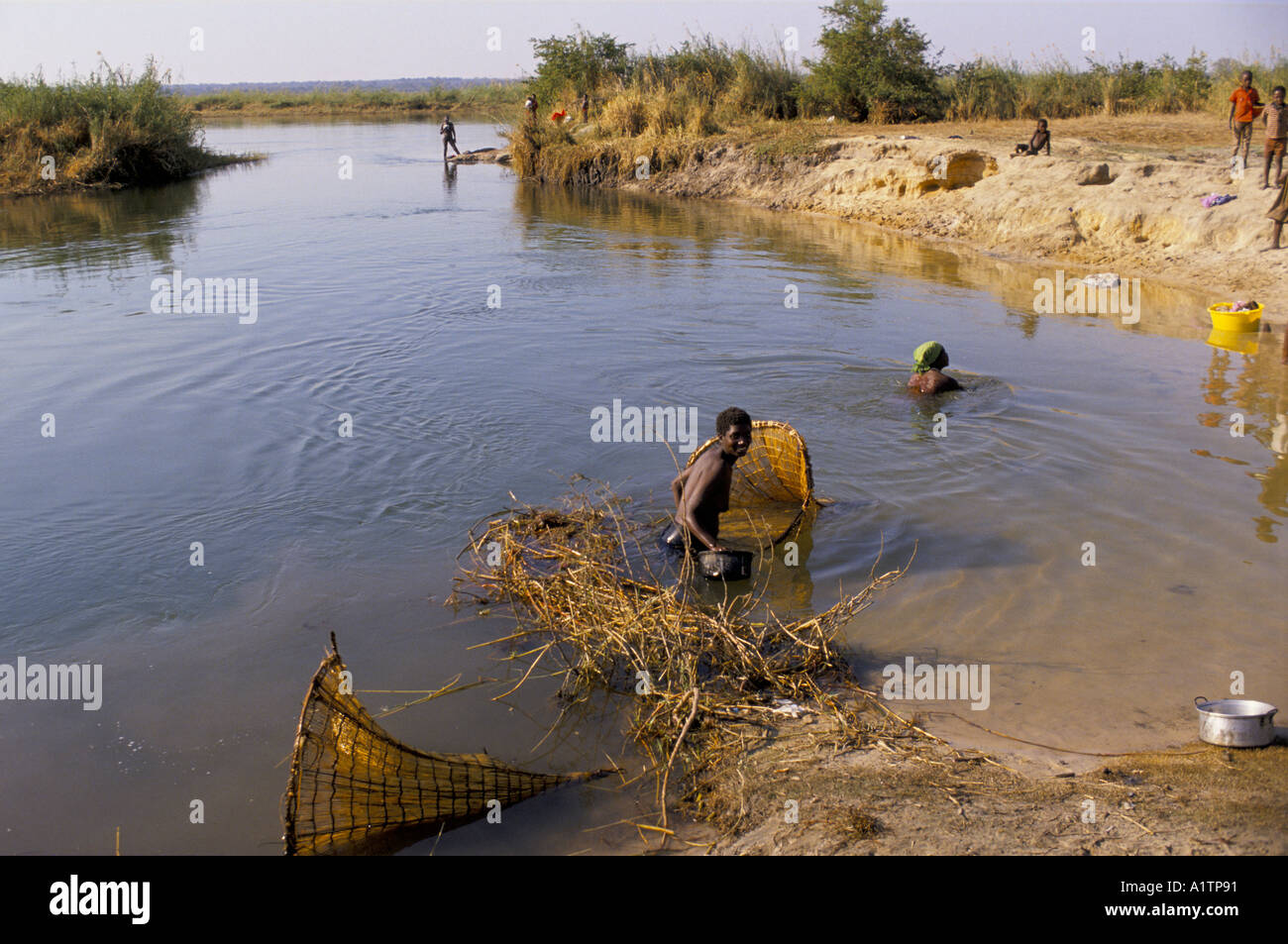 LOCALS USING FISHING NETS RUNDU NAMIBIA Stock Photo - Alamy